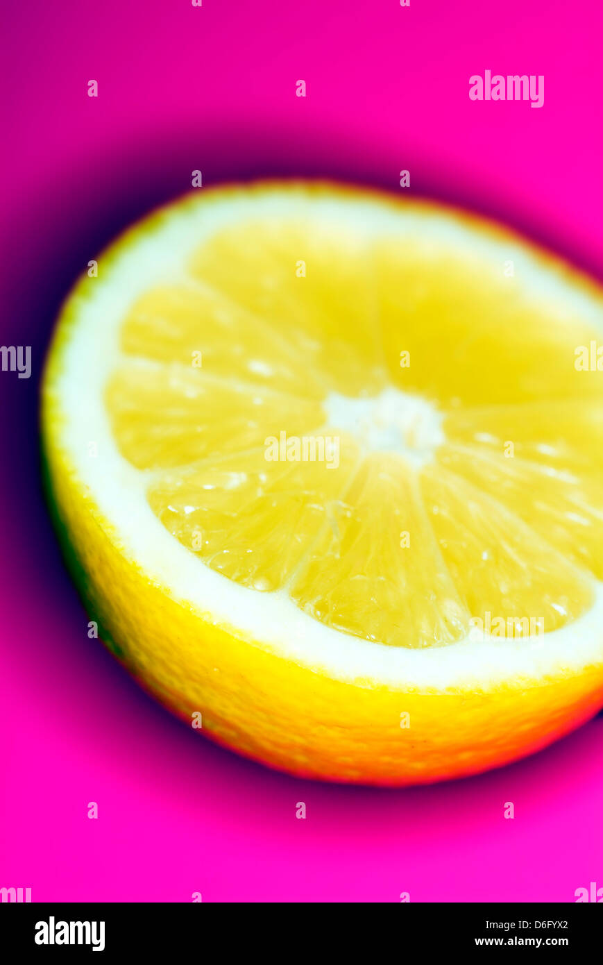 Lemon on purple Stock Photo - Alamy