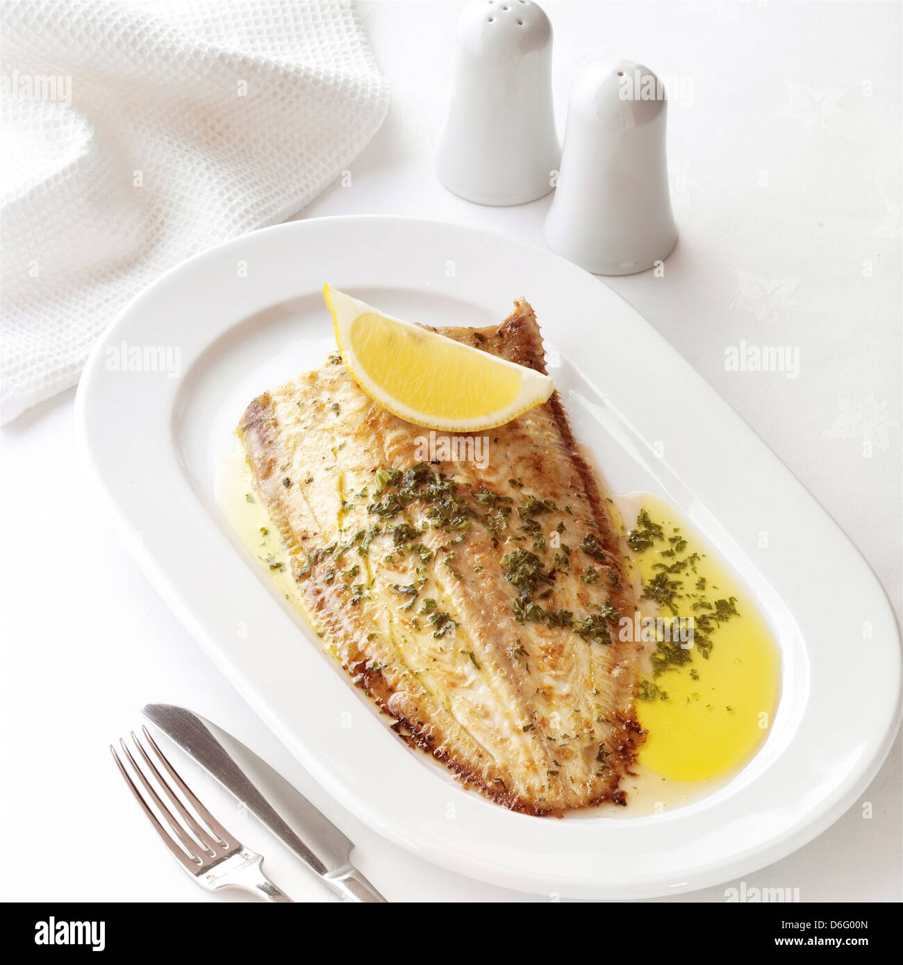 Fish with lemon slice Stock Photo - Alamy