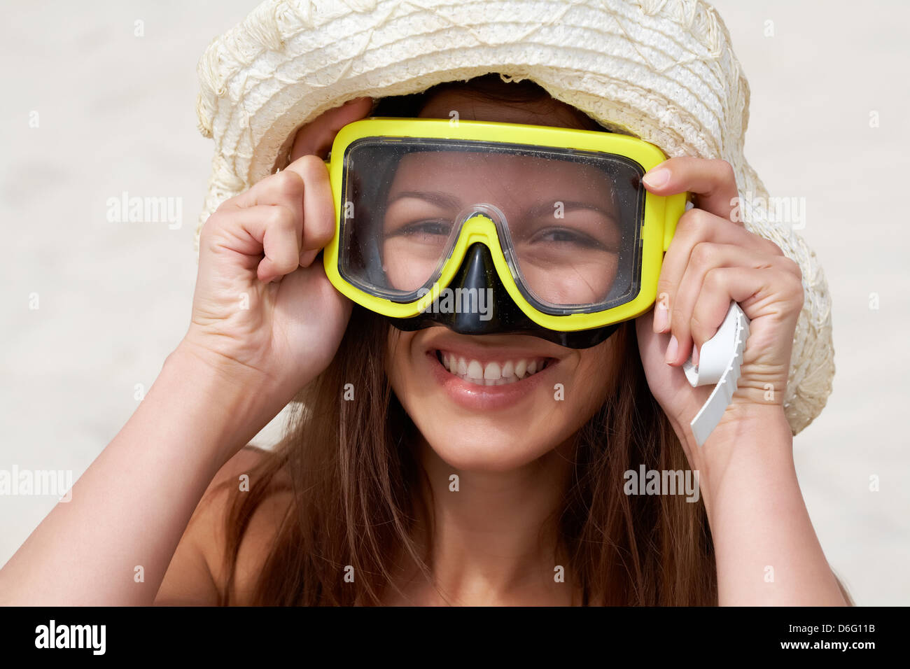 Image of pretty girl in hat looking at camera through goggles Stock ...