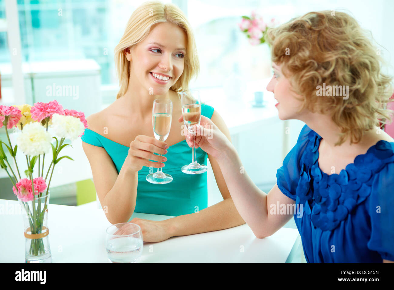 Gorgeous girls drinking alcohol on some occasion Stock Photo - Alamy