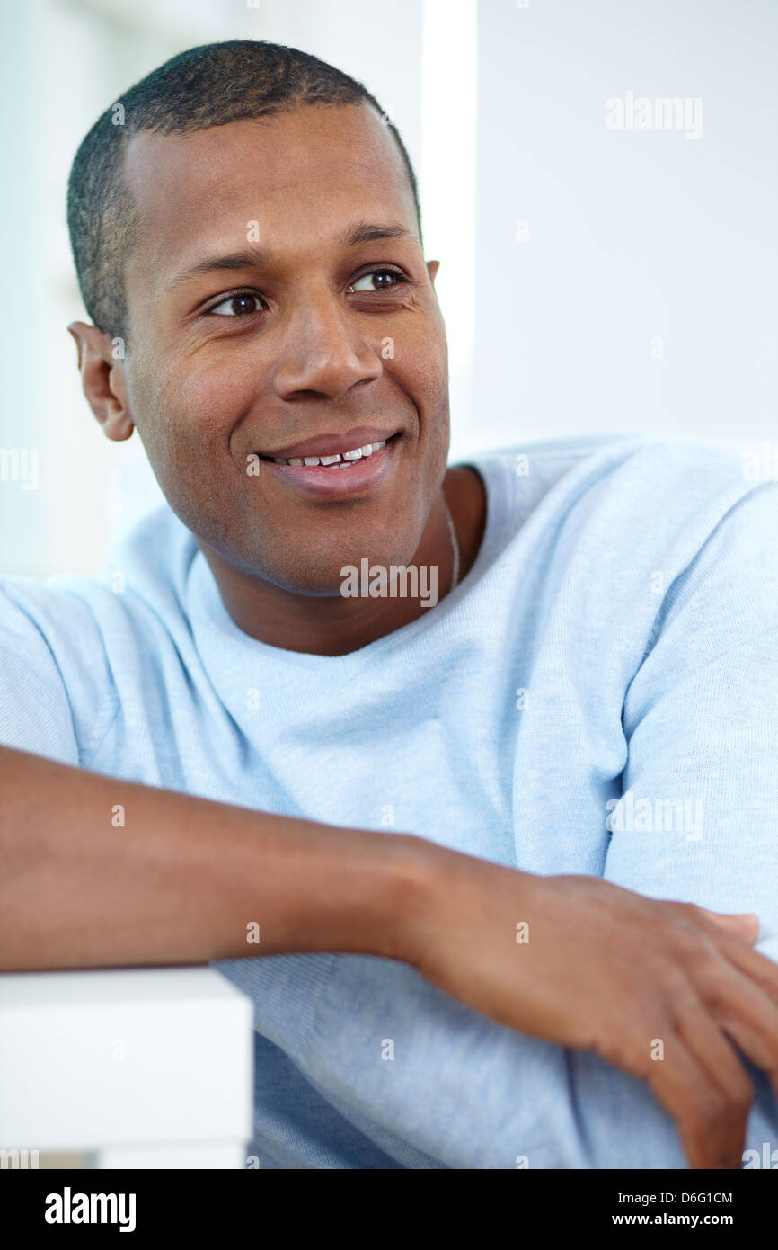 Image of young African man looking aside with calm expression Stock ...