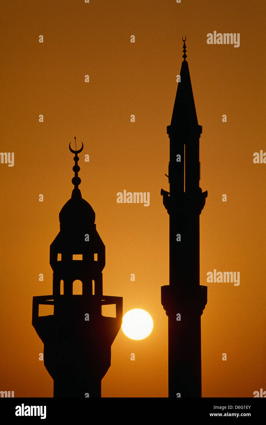 jeddah, saudi arabia -- sunset with minarets of a mosque in the ...