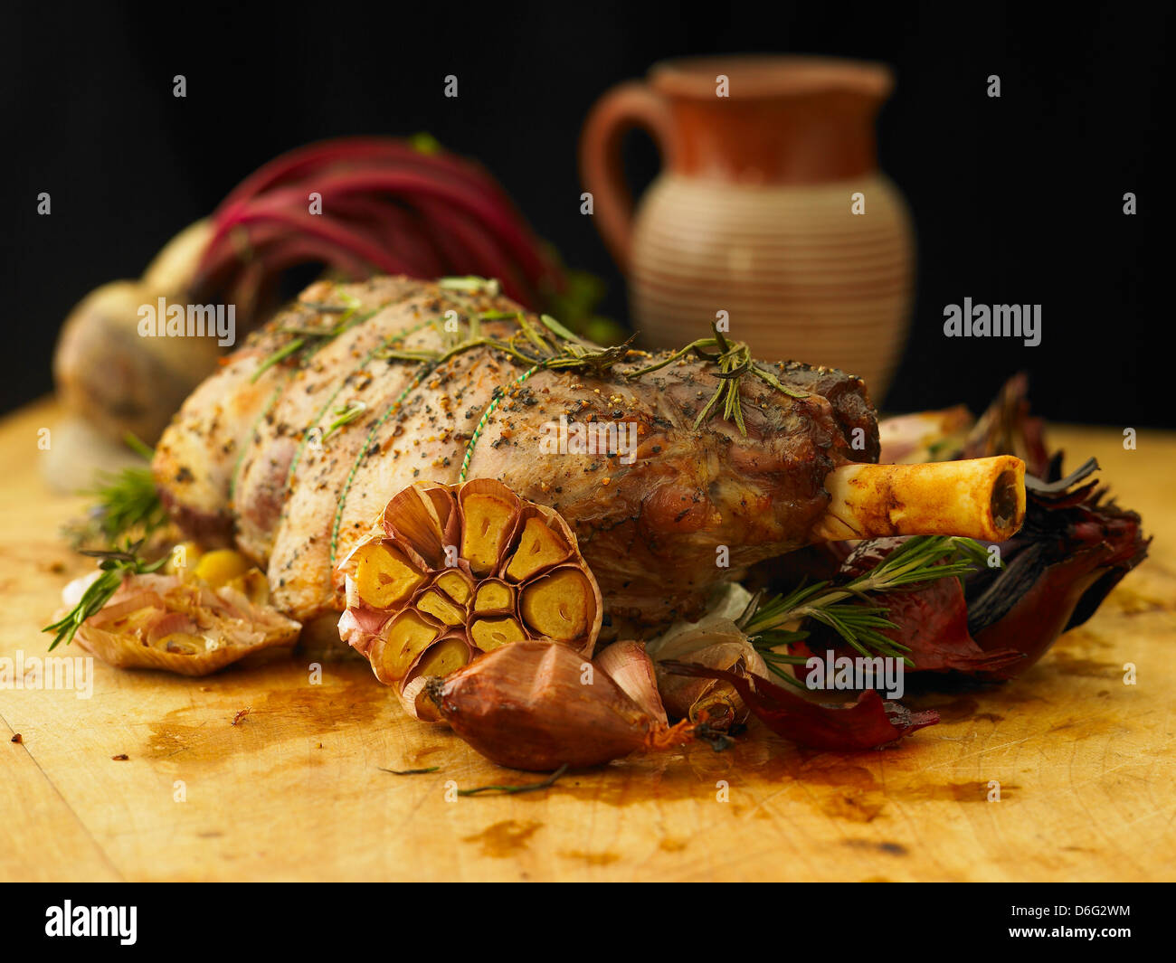 Sliced leg of stuffed lamb with garlic, rosemary and roast onion Stock ...