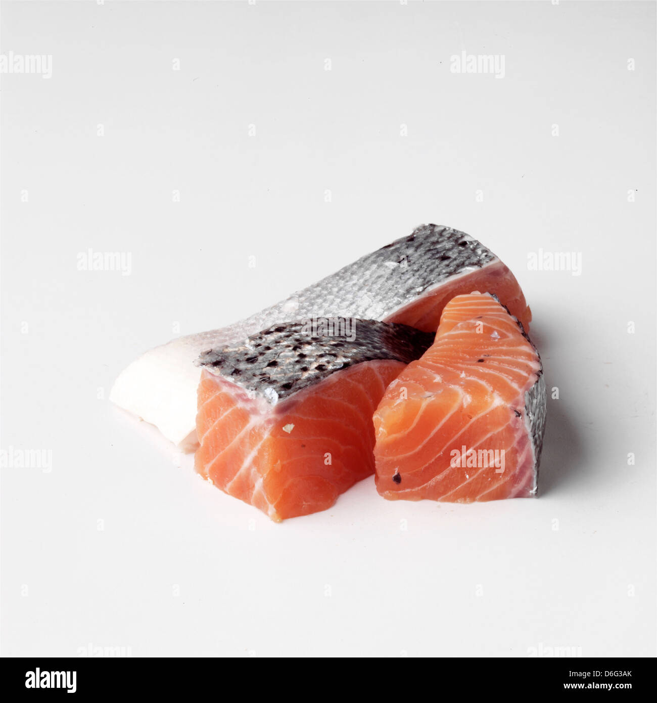 Salmon fillet cut into three pieces with skin on Stock Photo - Alamy