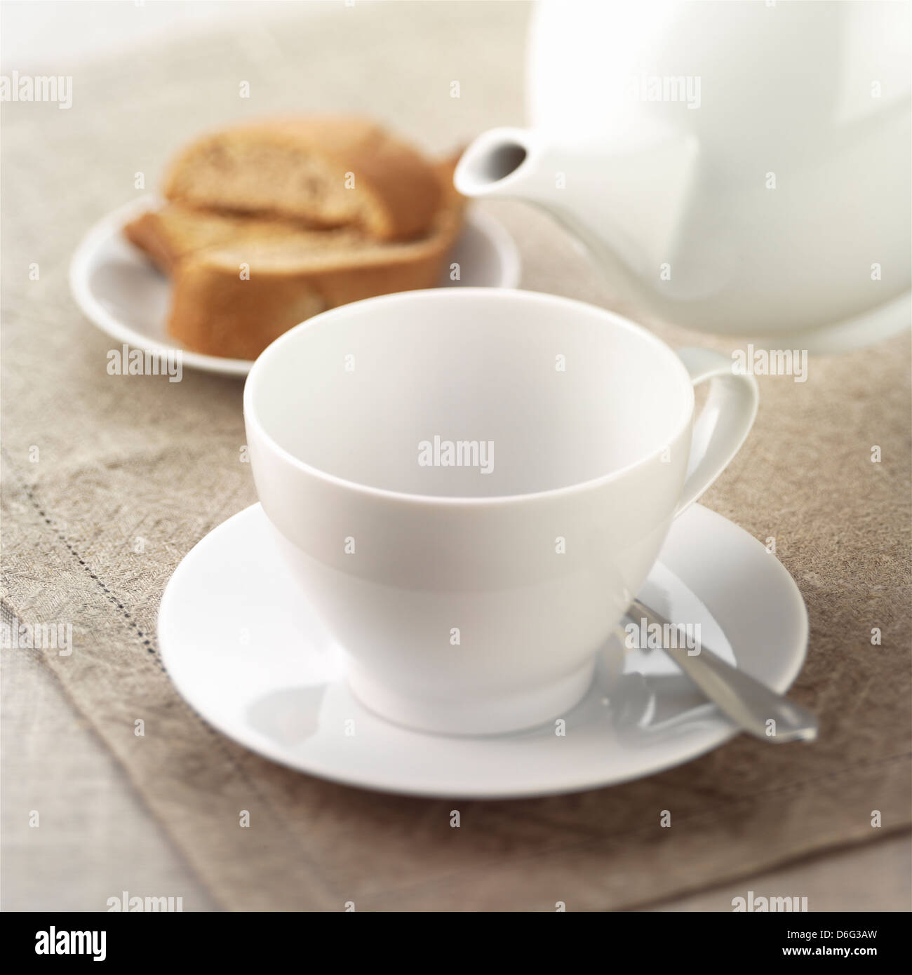 Empty Teacup with teapot and toast Stock Photo - Alamy