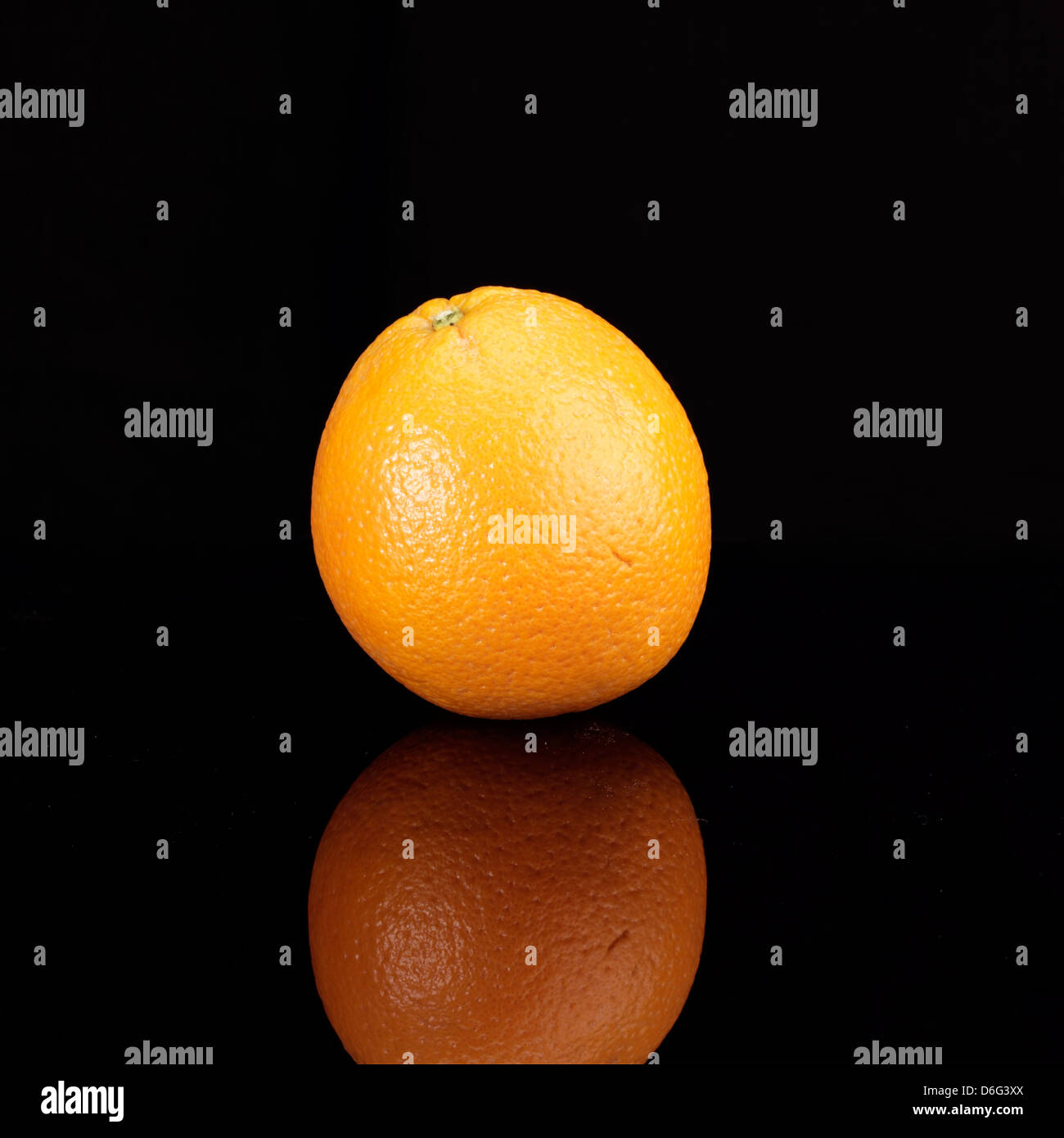 Orange and its reflection Stock Photo - Alamy