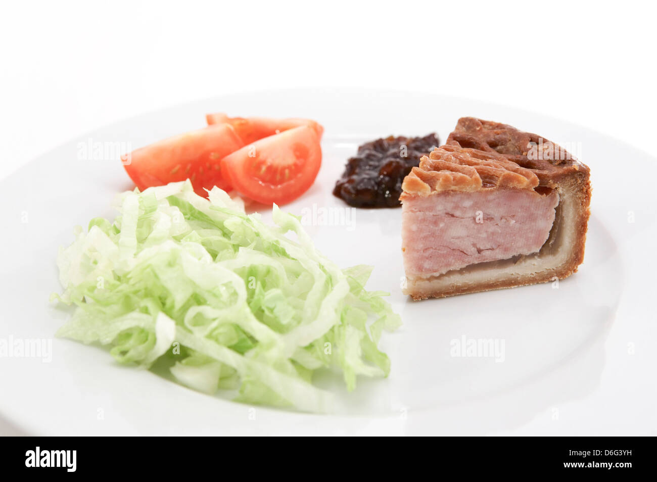 Pork Pie Slice with Lettuce, Tomato and Pickle Stock Photo - Alamy