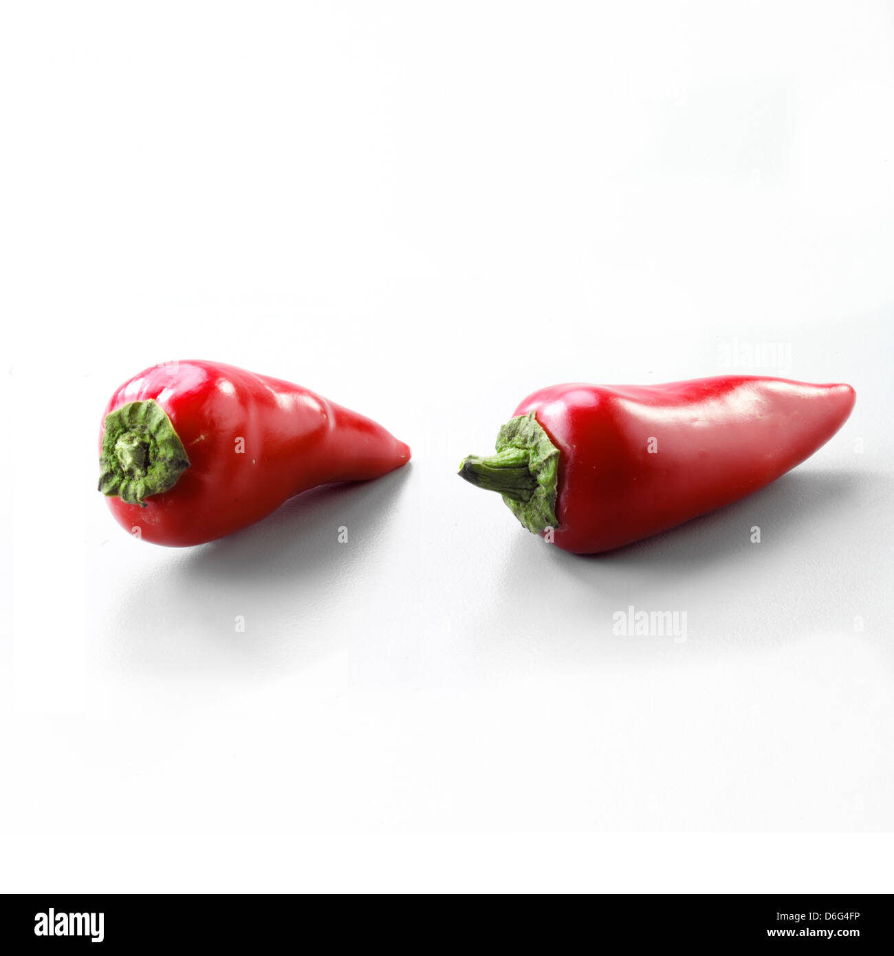Two Red Chilli Peppers Stock Photo - Alamy