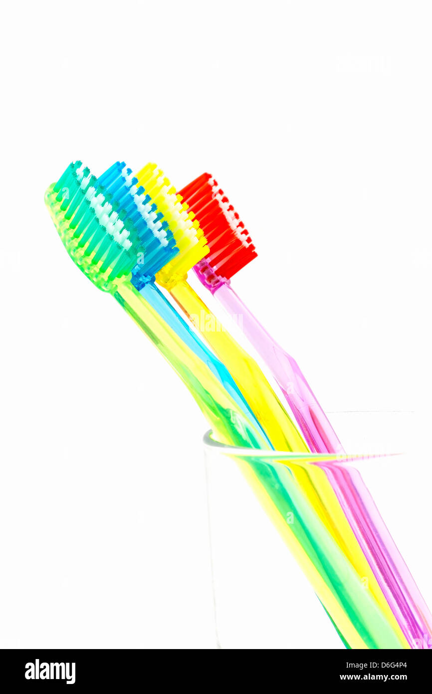 Colorful toothbrush in glass Stock Photo - Alamy
