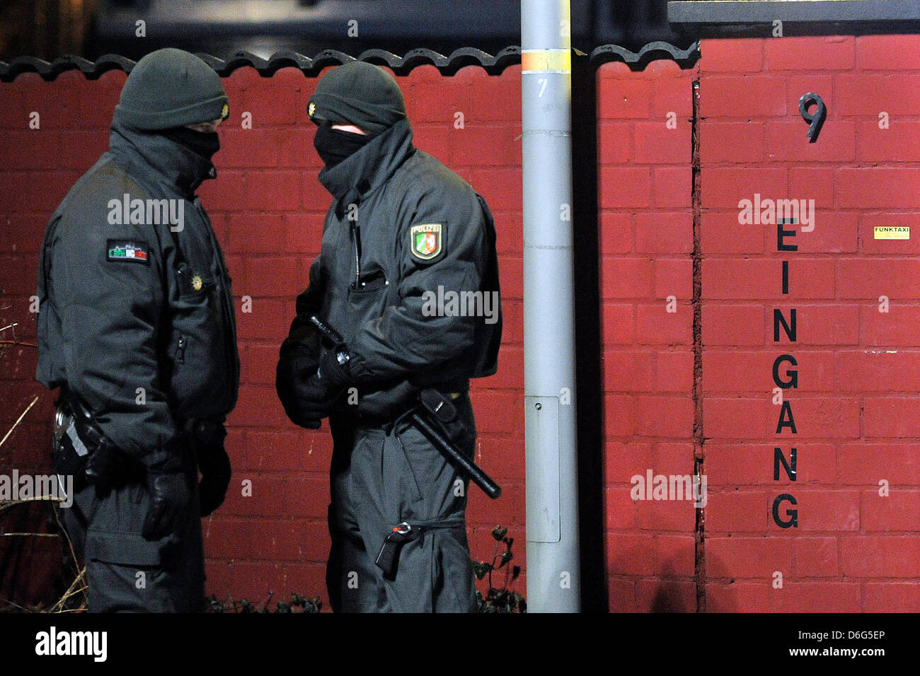 Police officers stand in front of a brothel in Leverkusen, Germany, 09 ...