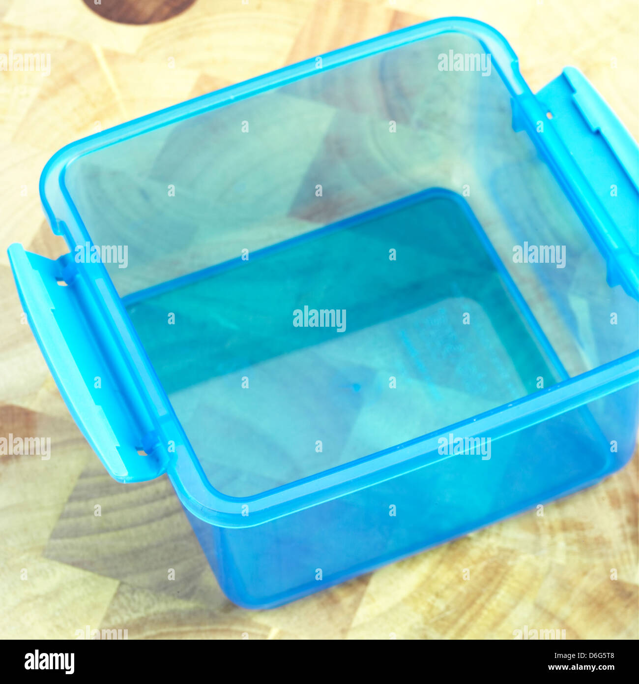 Empty blue food container Stock Photo - Alamy