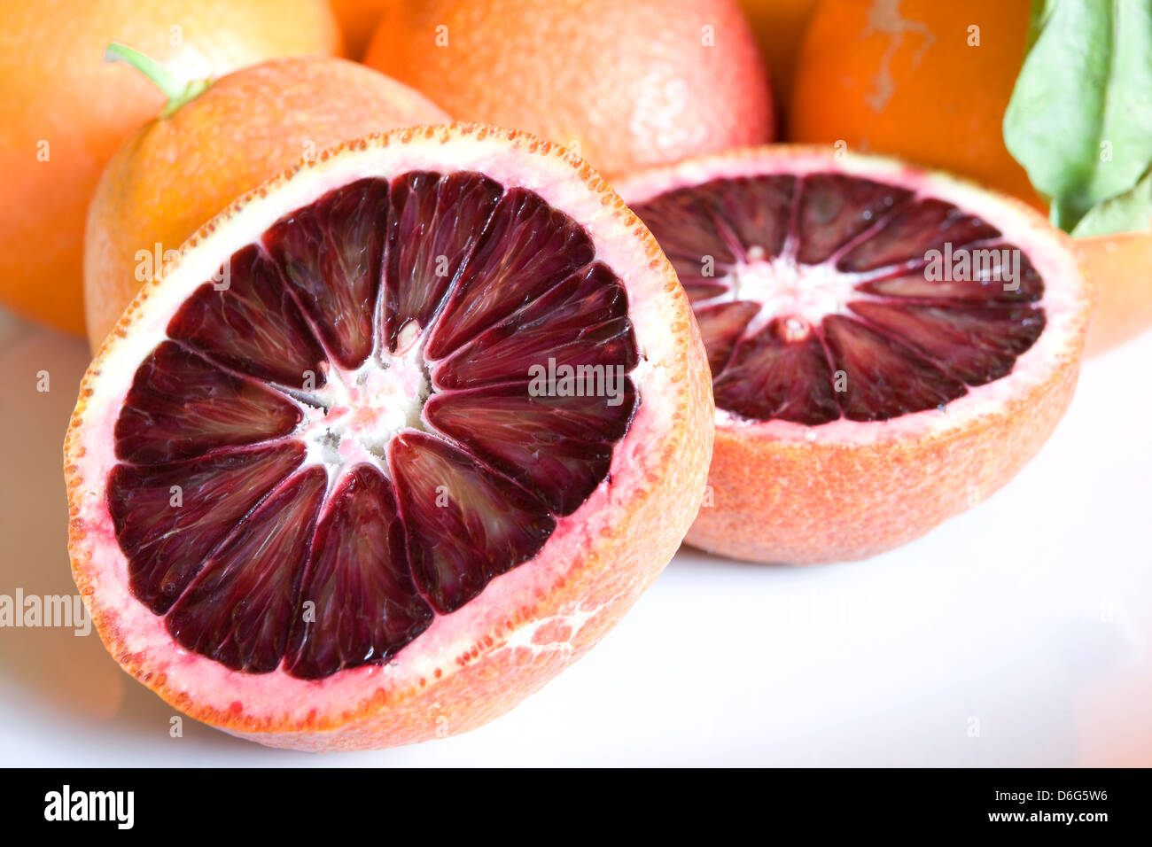 Fresh blood oranges cut in half Stock Photo - Alamy