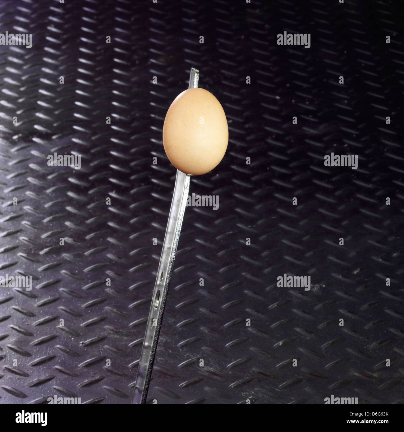 Egg Impaled on a Blade Stock Photo - Alamy