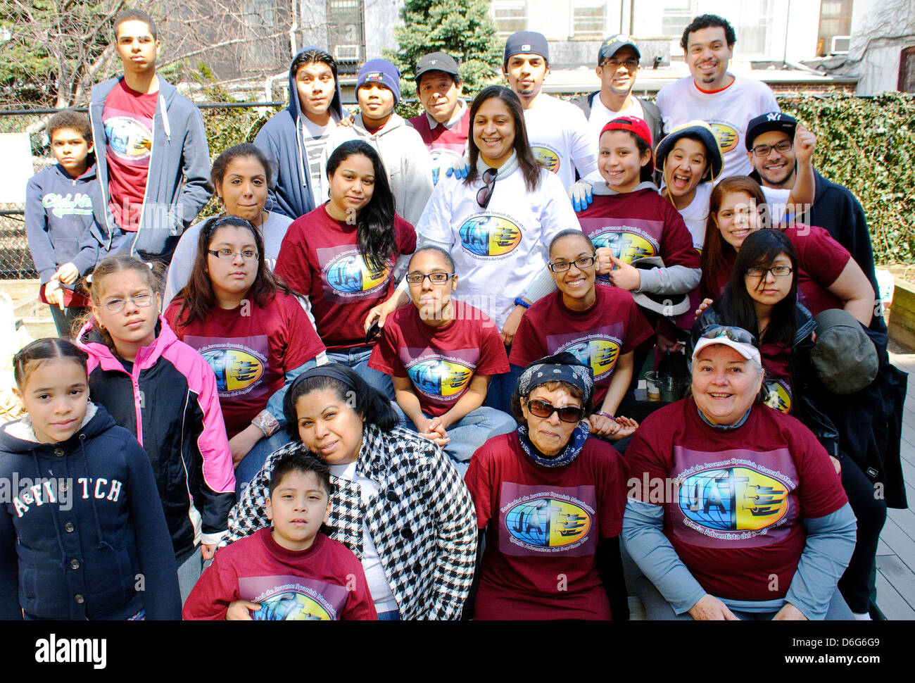 Teenage and adult Hispanic community service volunteers...(see ...