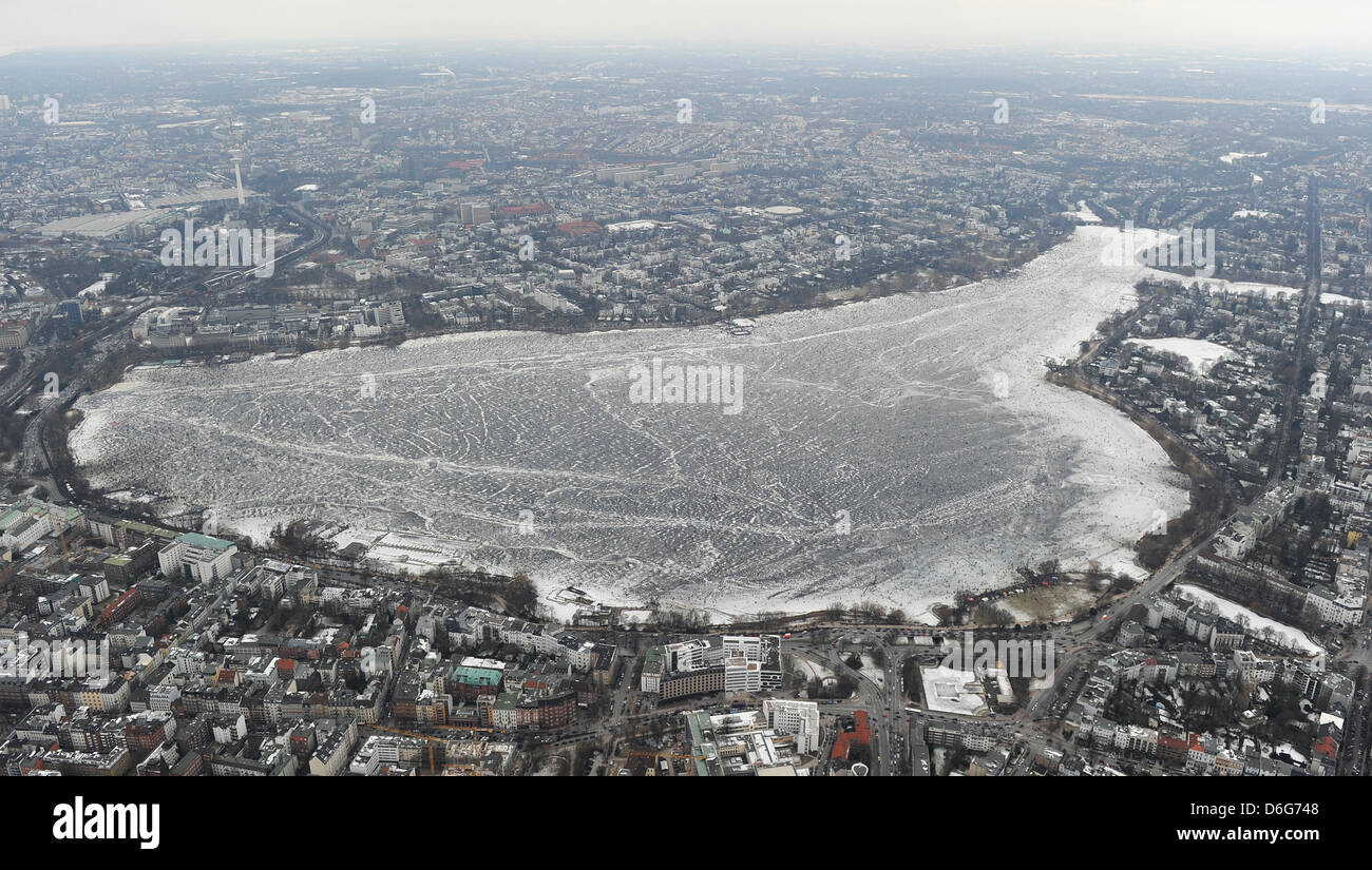 Thousands of people walk on the frozen Outer Alster in Hamburg, Germany ...
