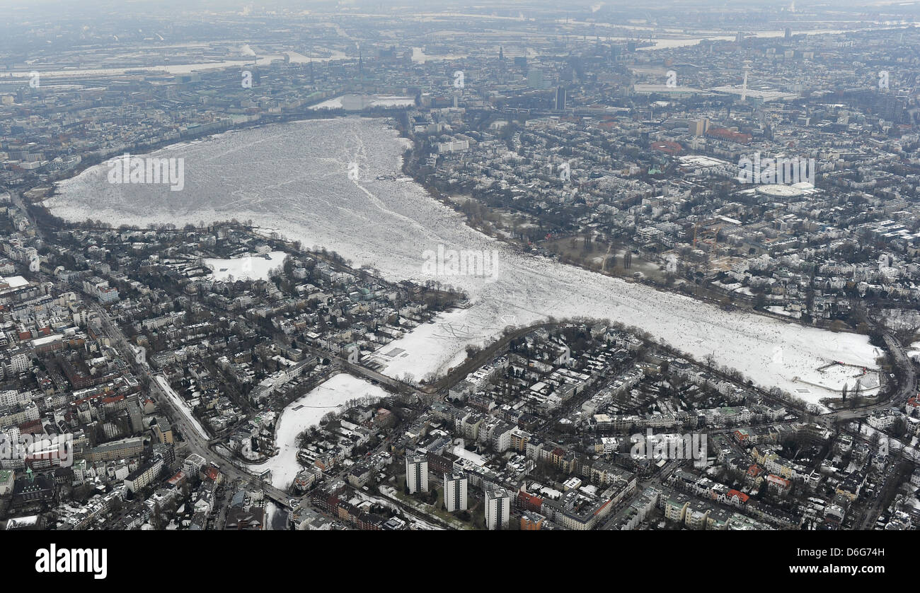 Thousands of people walk on the frozen Outer Alster in Hamburg, Germany ...