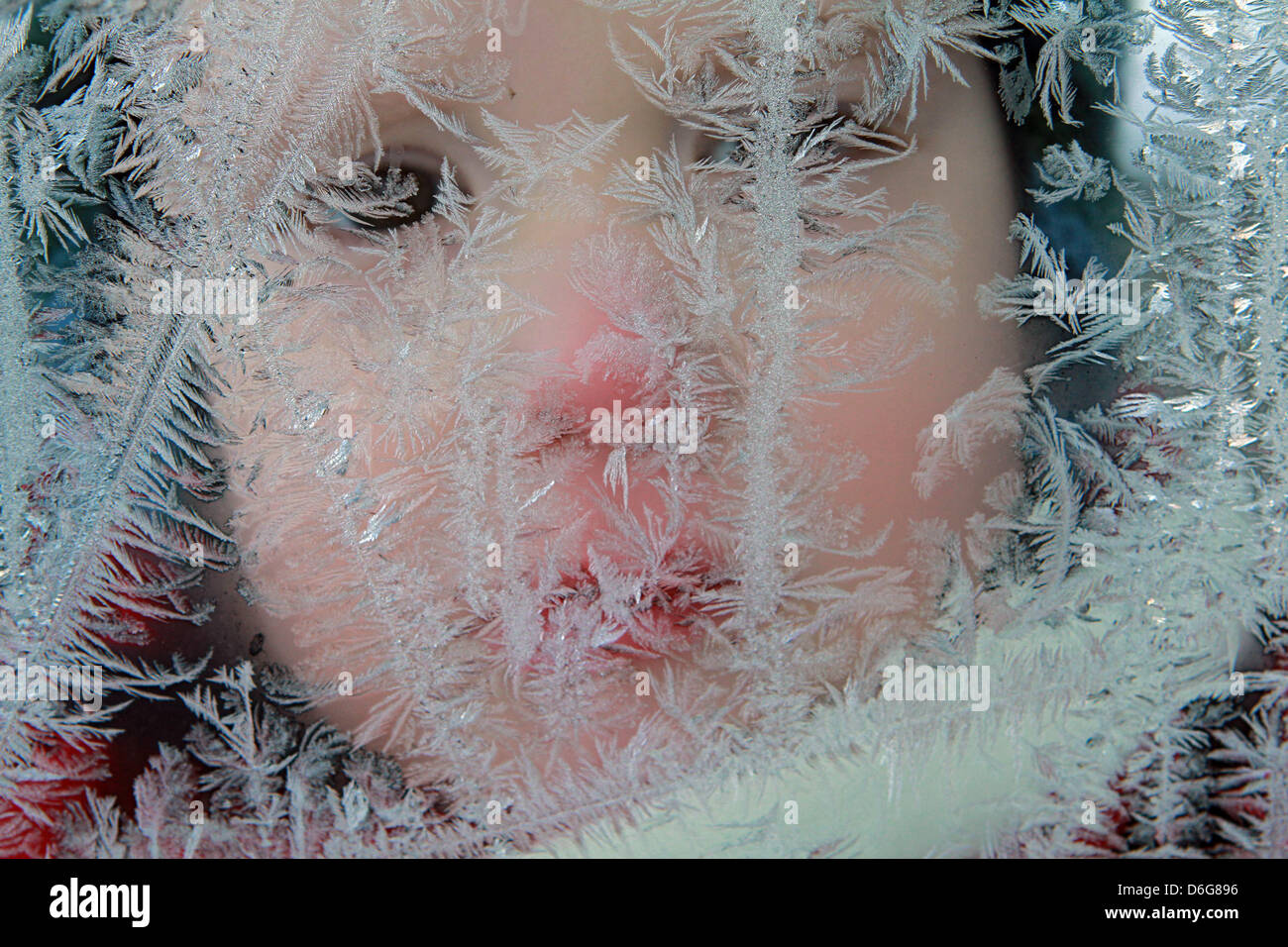 An illustration shows a child behind frostwork on a window in Wernigerode, Germany, 11 February ...