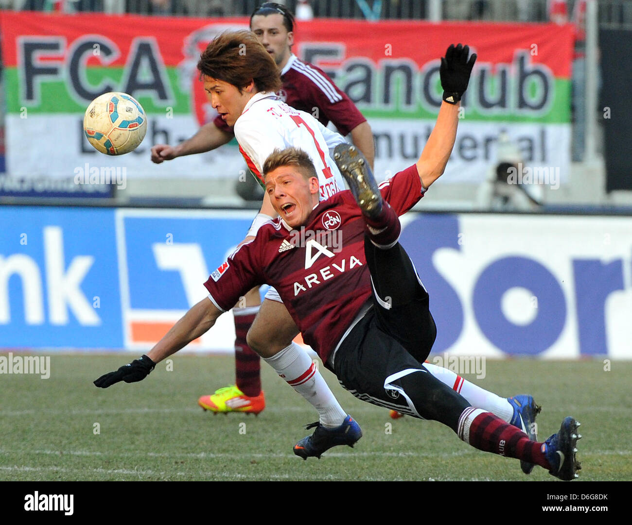 Augsburg's Hajime Hosogai (R) and Nuremberg's Mike Frantz vie for the ...