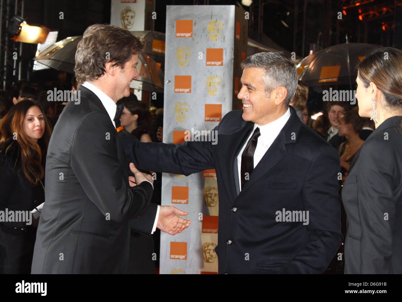 Actors Colin Firth (L) and George Clooney (R) meet during the British ...