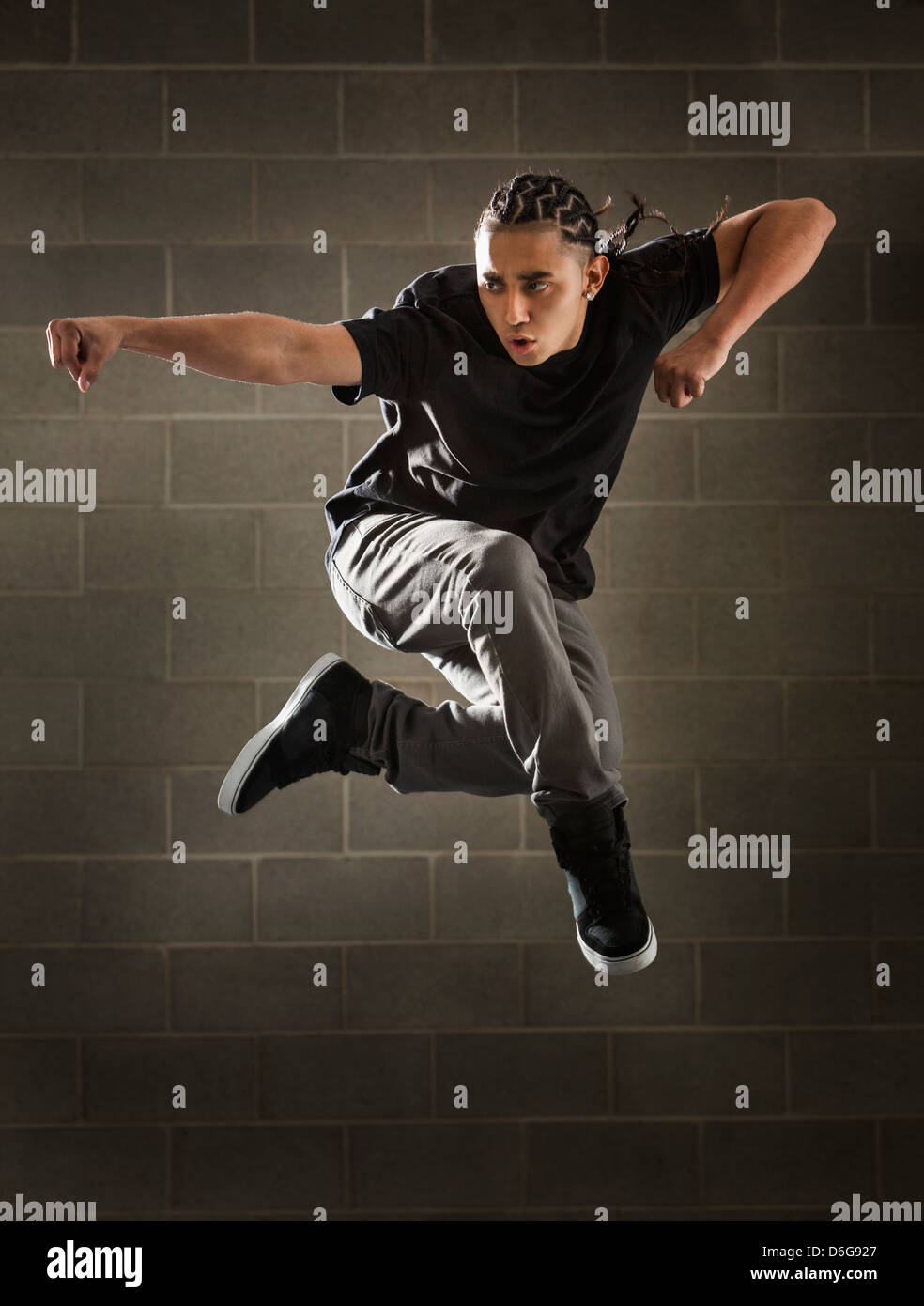 Hispanic dancer leaping in mid air Stock Photo - Alamy