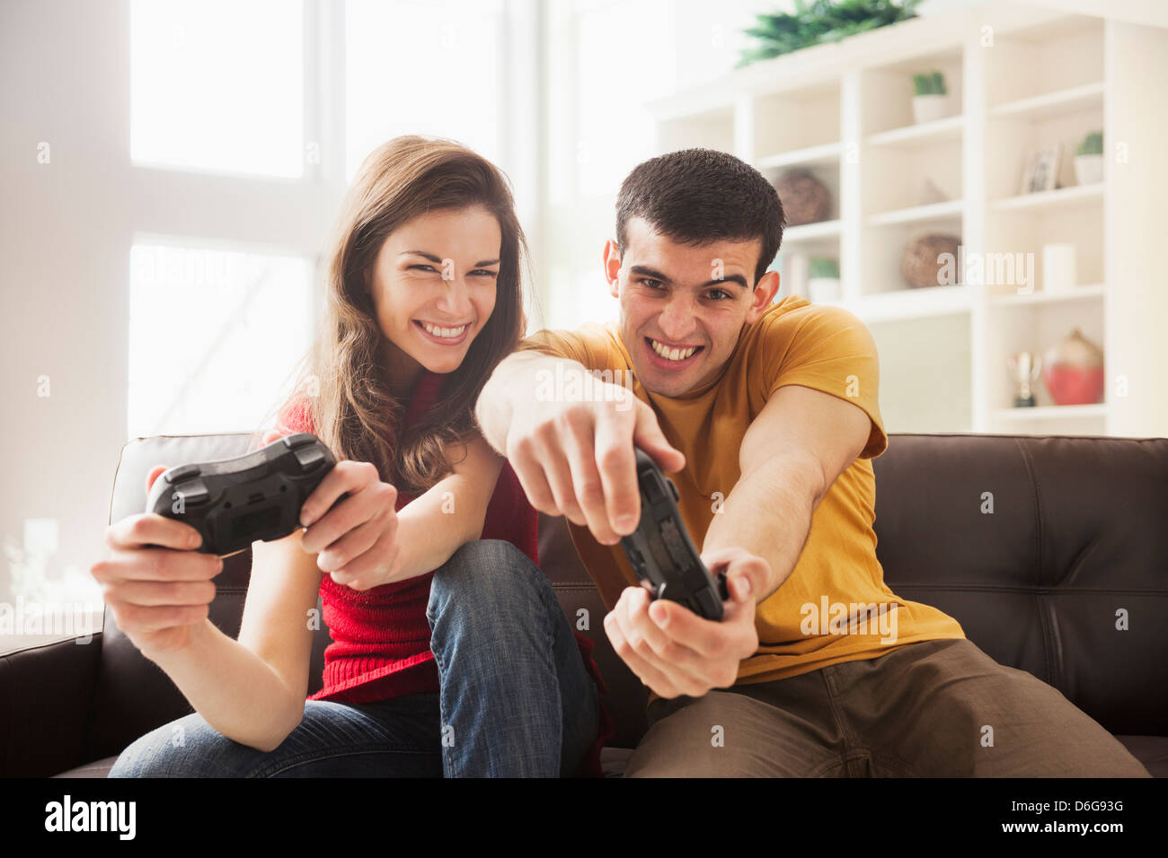 Couple playing video games together Stock Photo - Alamy