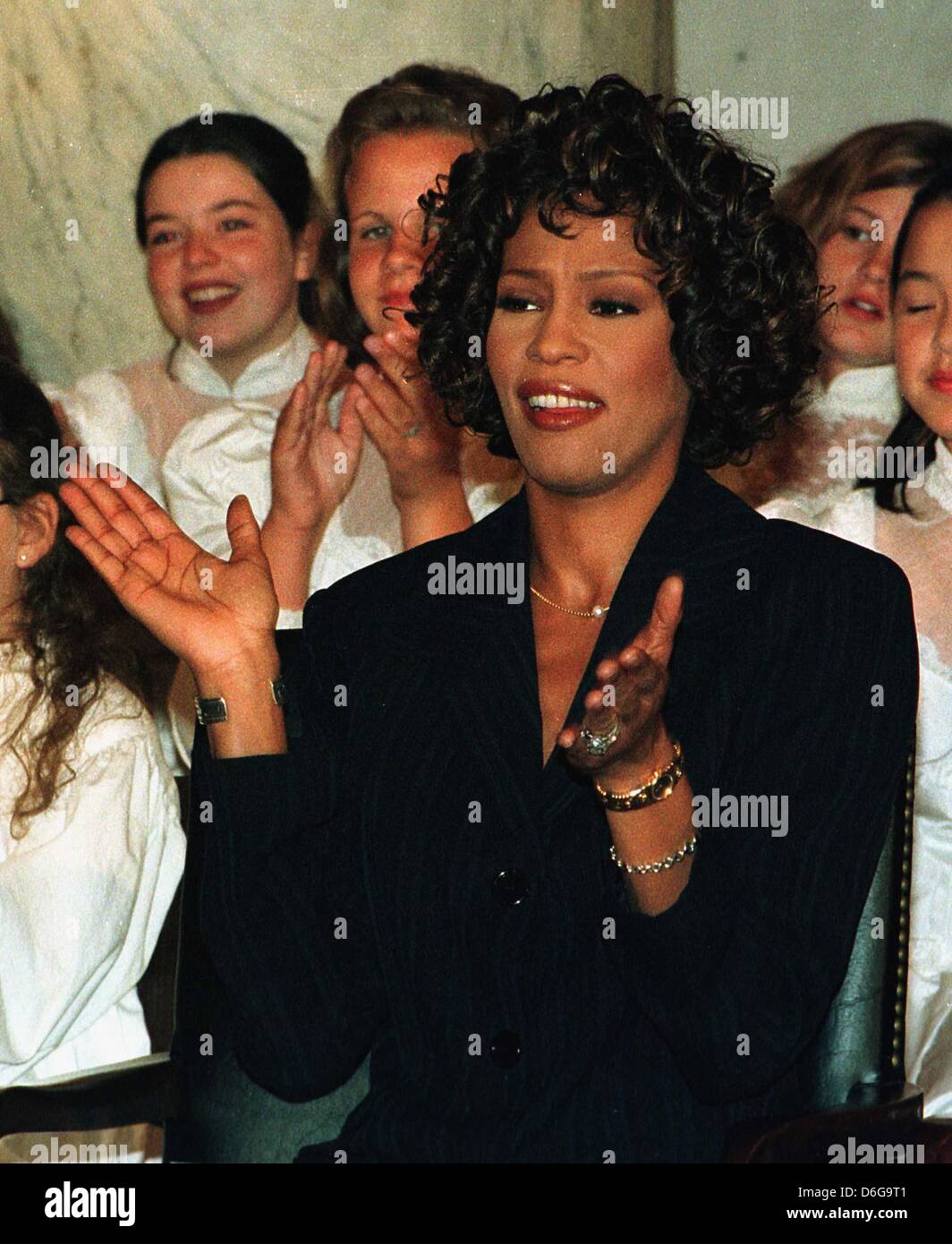 Whitney Houston applauds during a Capitol Hill press confrence on ...