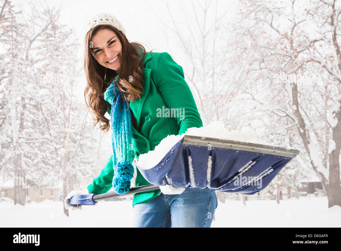 Woman shoveling snow hi-res stock photography and images - Alamy