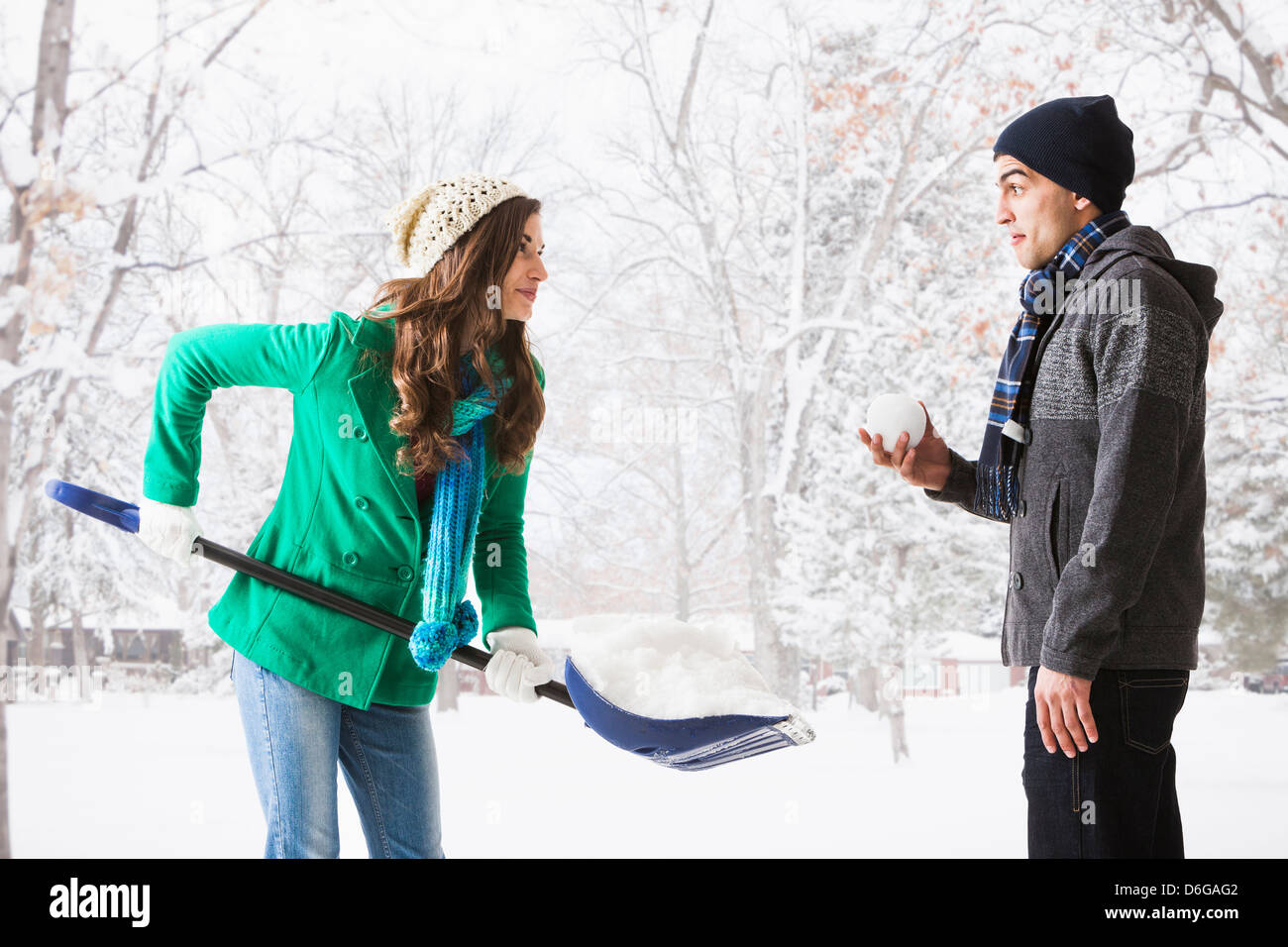 Hispanic woman shoveling snow hi-res stock photography and images - Alamy