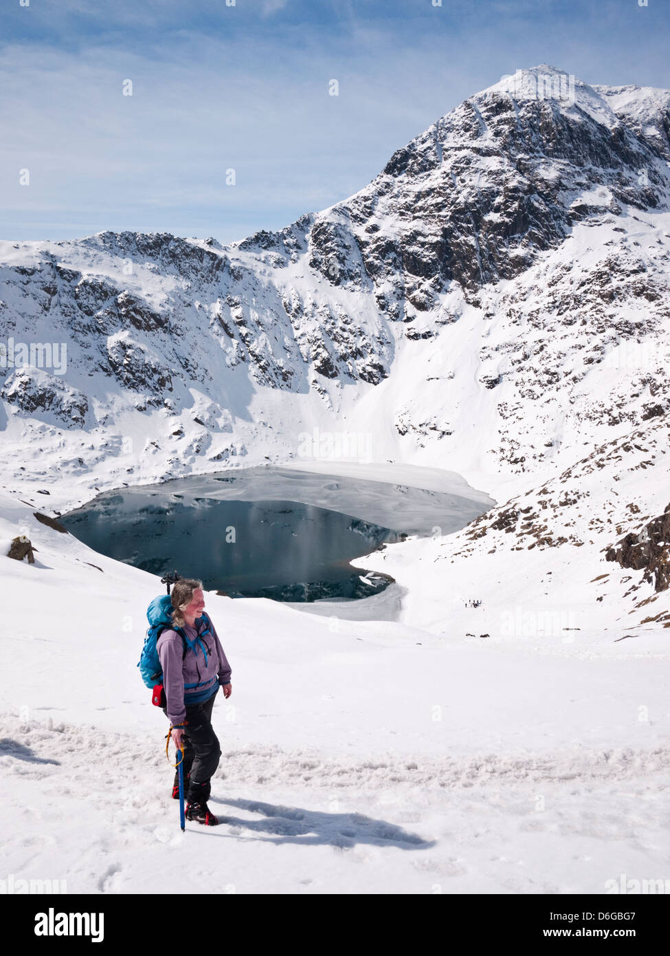 Snowdon in winter conditions - a female hill walker on the Pyg track ...