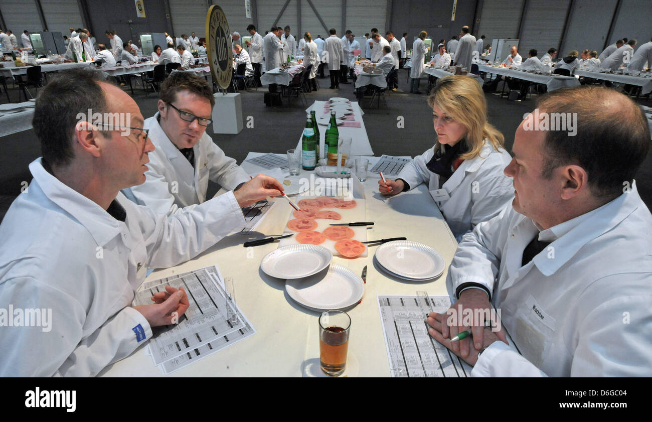 Testers evaluate various products during a quality test of ham and ...