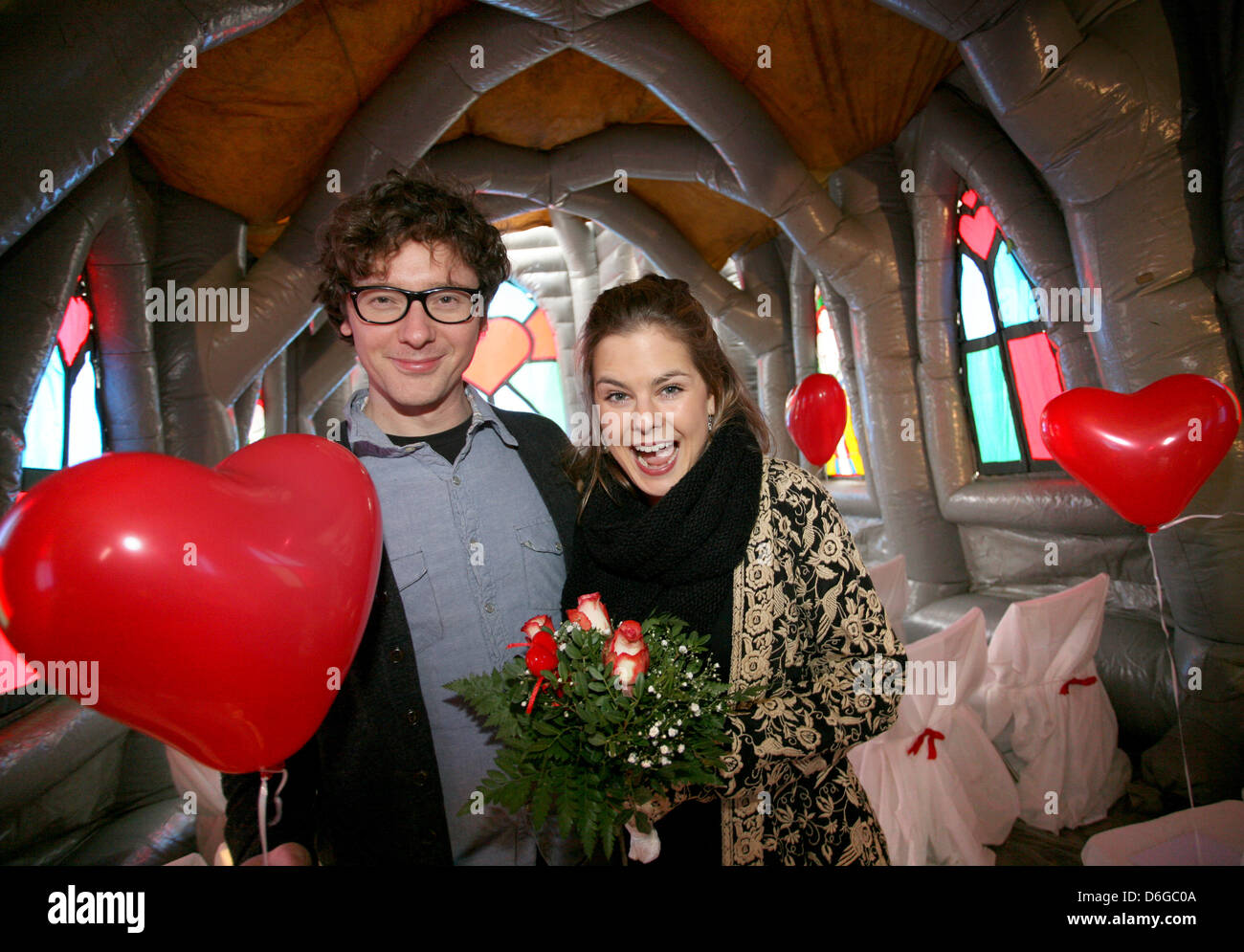 Pia Walter und Maxence Lepesant stand in an inflatable church for trial ...