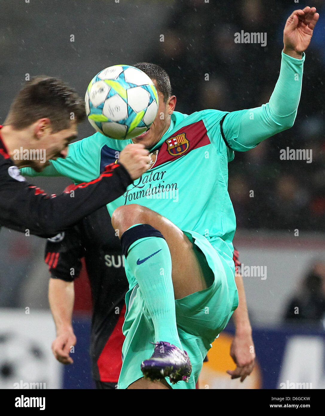 Barcelona's Sergio Busquets (R) and Daniel Schwaab of Leverkusen vie ...