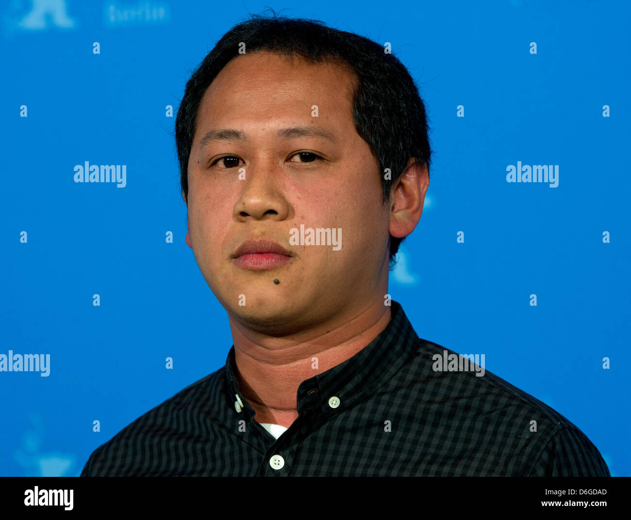 Director Edwin is posing at a photocall for the movie "Postcards from ...