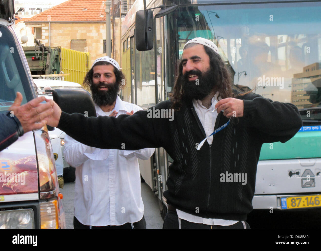 A member of the Breslov Hasidicism dances in the street to loud music ...