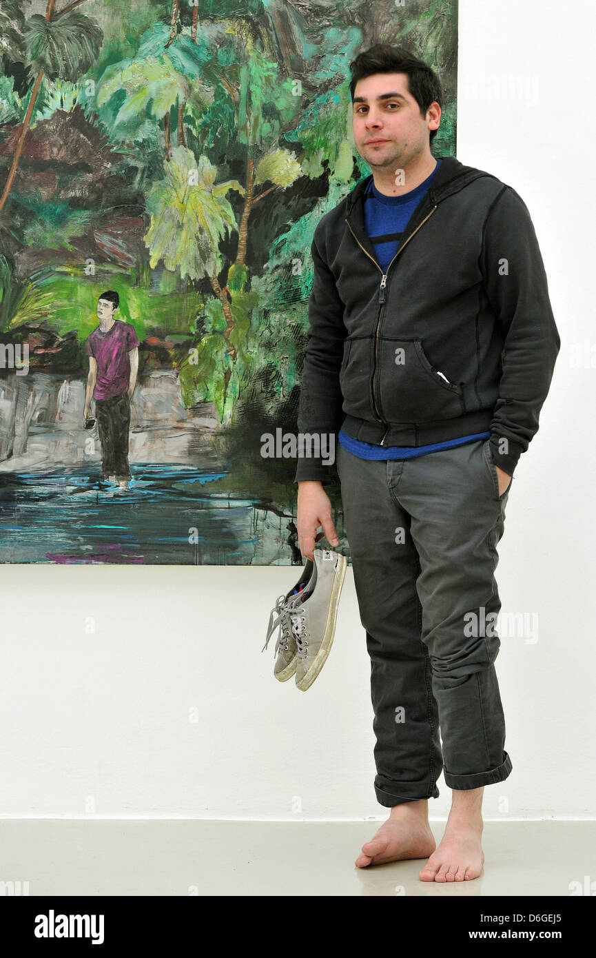 US artist Hernan Bas poses in front of his work 'An unclear, slowly ...