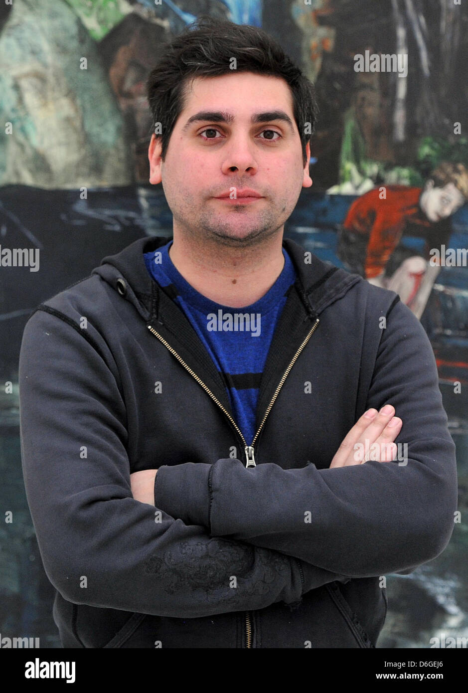 US artist Hernan Bas poses in front of his work 'golden...silver ...