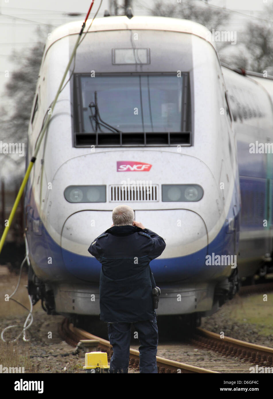Technicians inspect a double-decker high-speed train from France at the ...