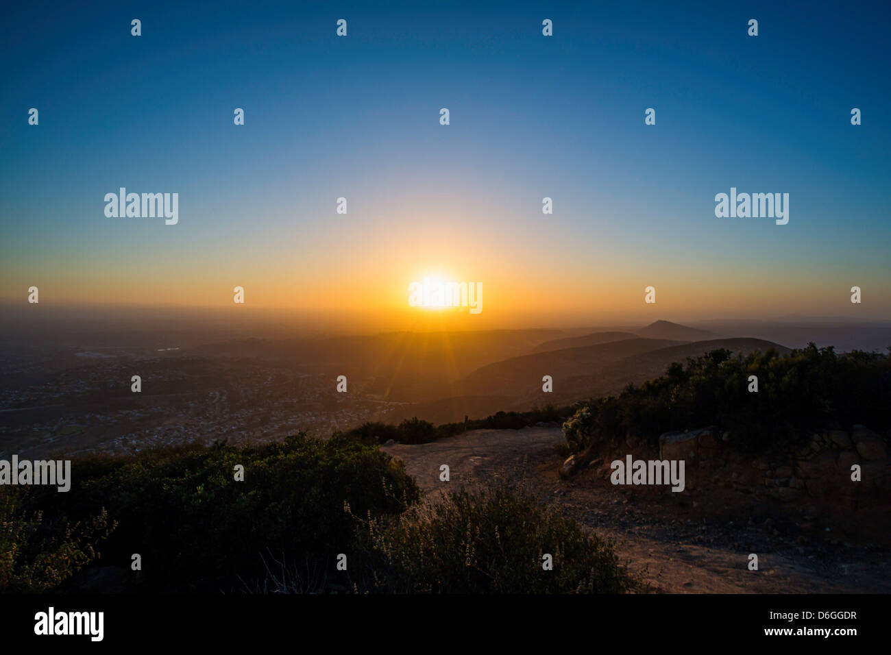Sun rising over rural landscape Stock Photo - Alamy