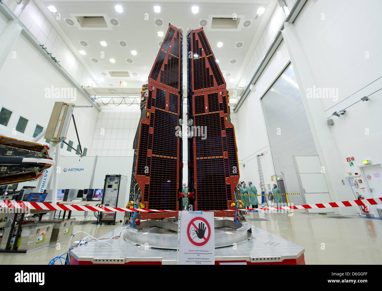 IABG employees inspect the ESA environmental satellite "Swarm" in a ...
