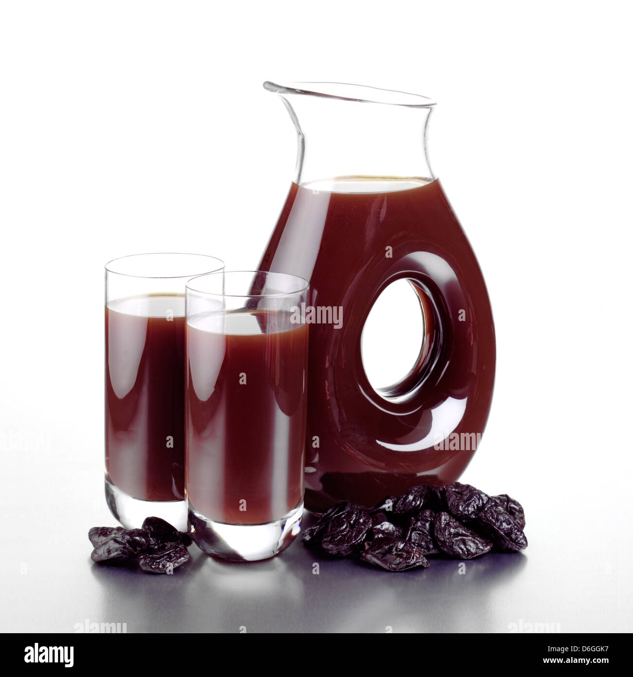 Jug of Prune Juice, Two Full Glasses and Dried Prunes Stock Photo - Alamy