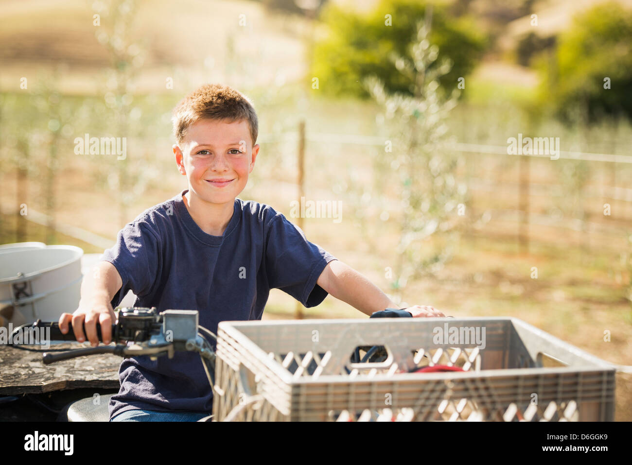 Caucasian boy driving four wheeler outdoors Stock Photo - Alamy