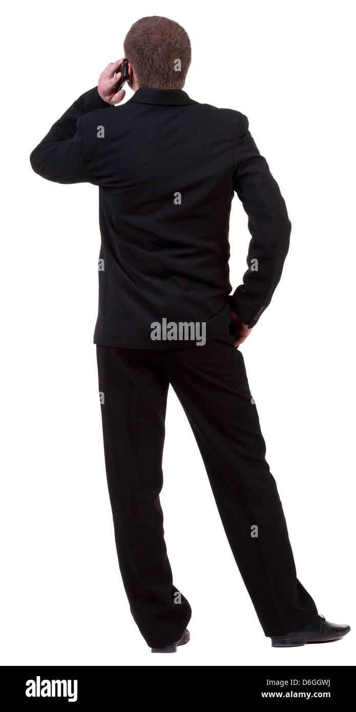 back view of business man in black suit talking on mobile phone. people ...