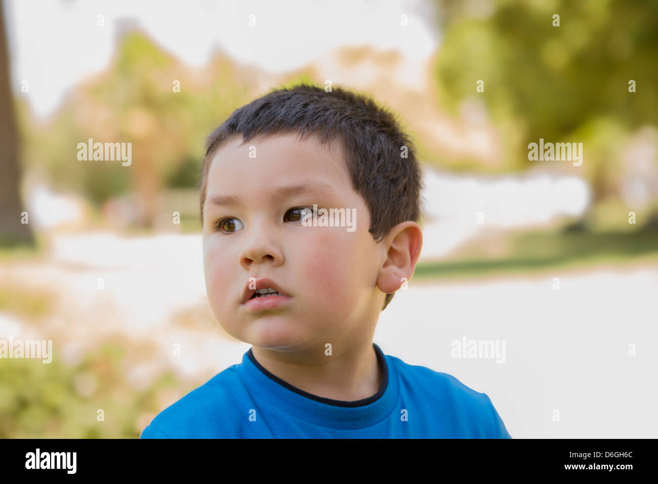 Hispanic boy standing outdoors Stock Photo - Alamy