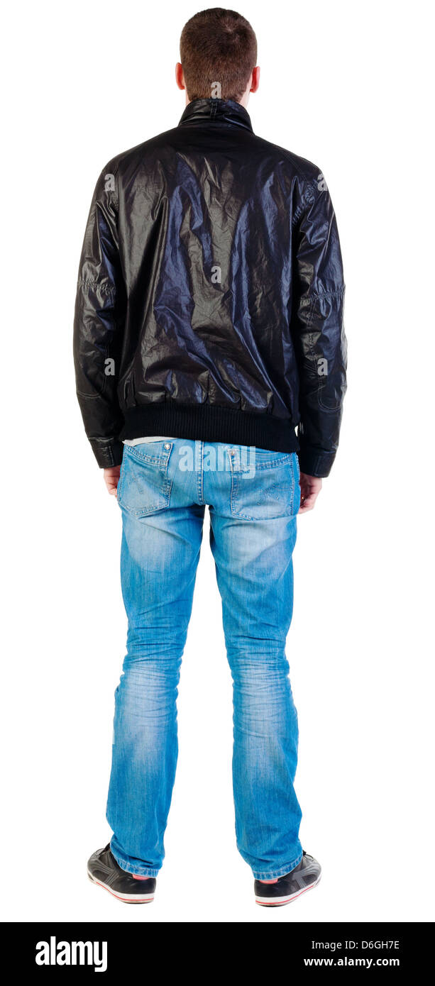 Back view of handsome man in jacket looking up. Standing young guy in ...
