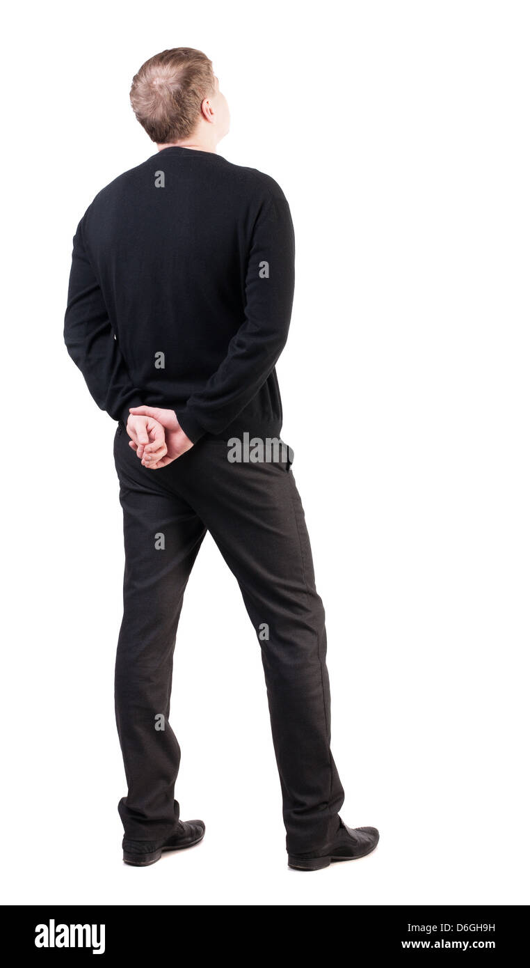 back view of Business man looks ahead. Young guy in sweater watching ...