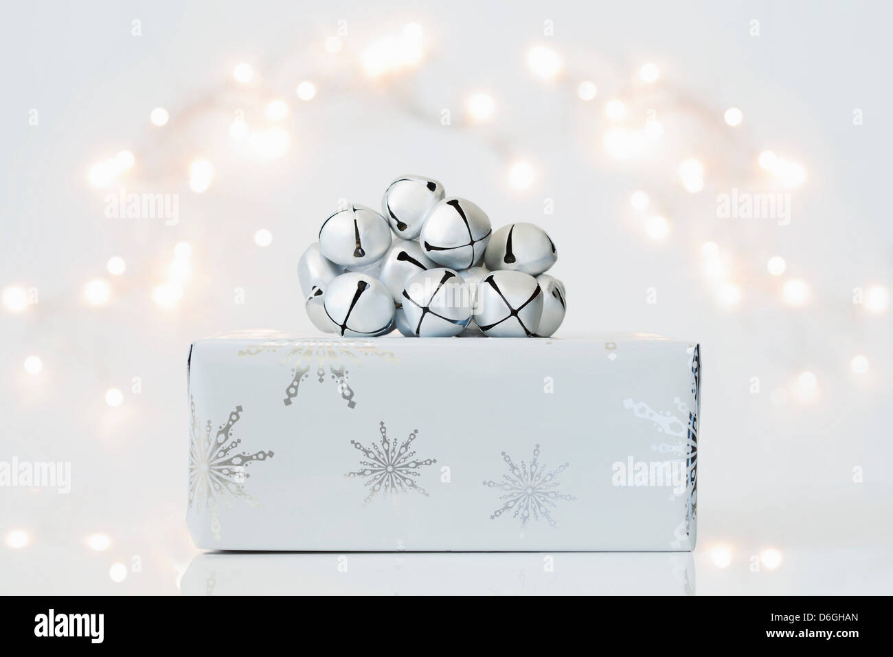 Christmas gift and jingle bells Stock Photo - Alamy