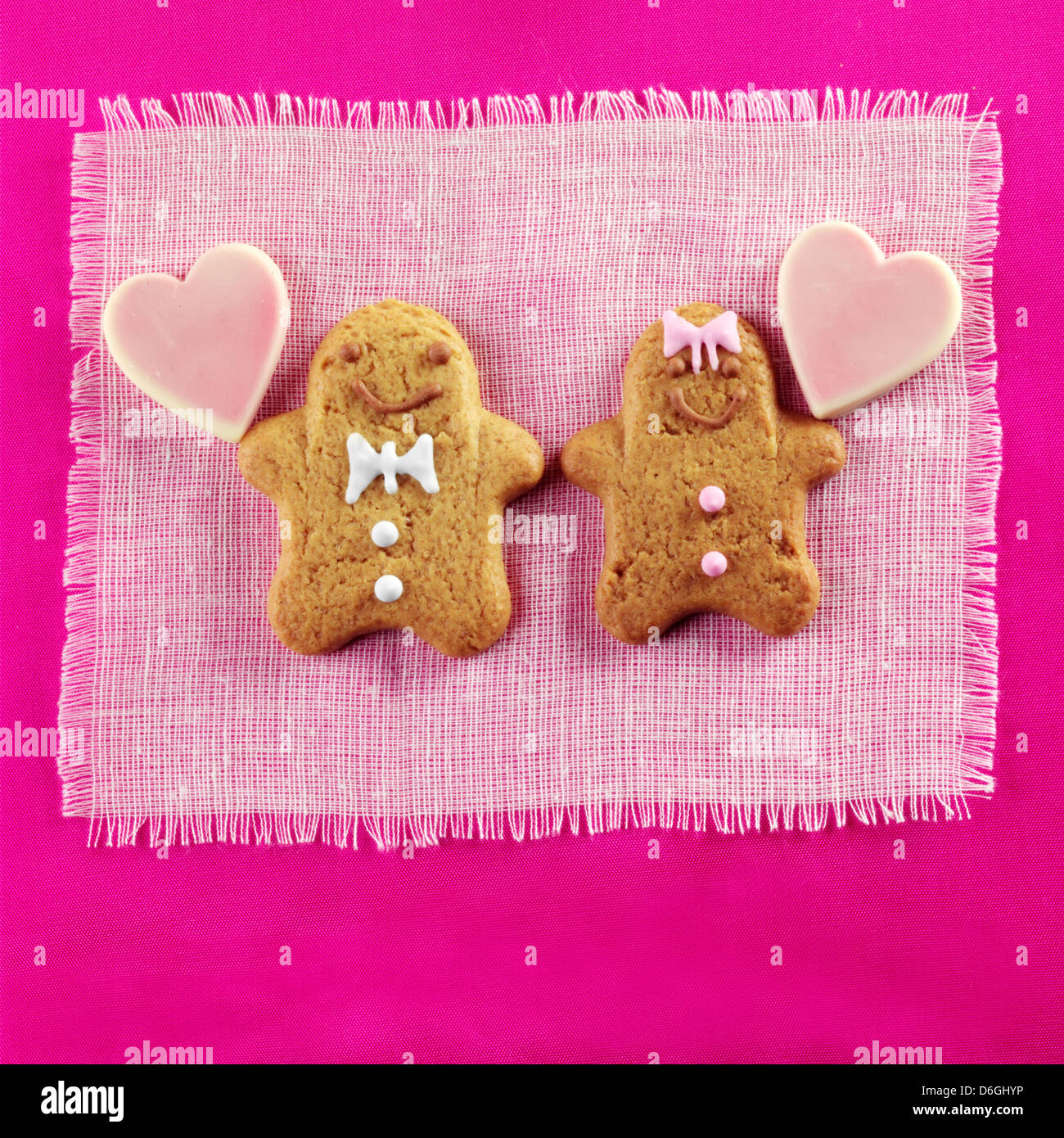 Woman decorate gingerbread heart hi-res stock photography and images ...
