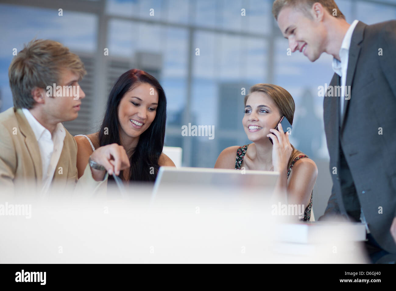 Business people talking at desk Stock Photo - Alamy