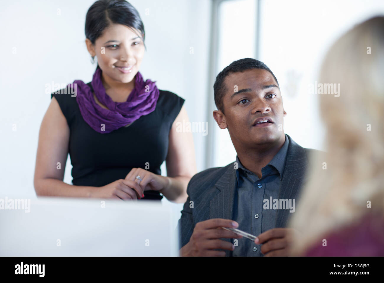 Business people talking at desk Stock Photo - Alamy