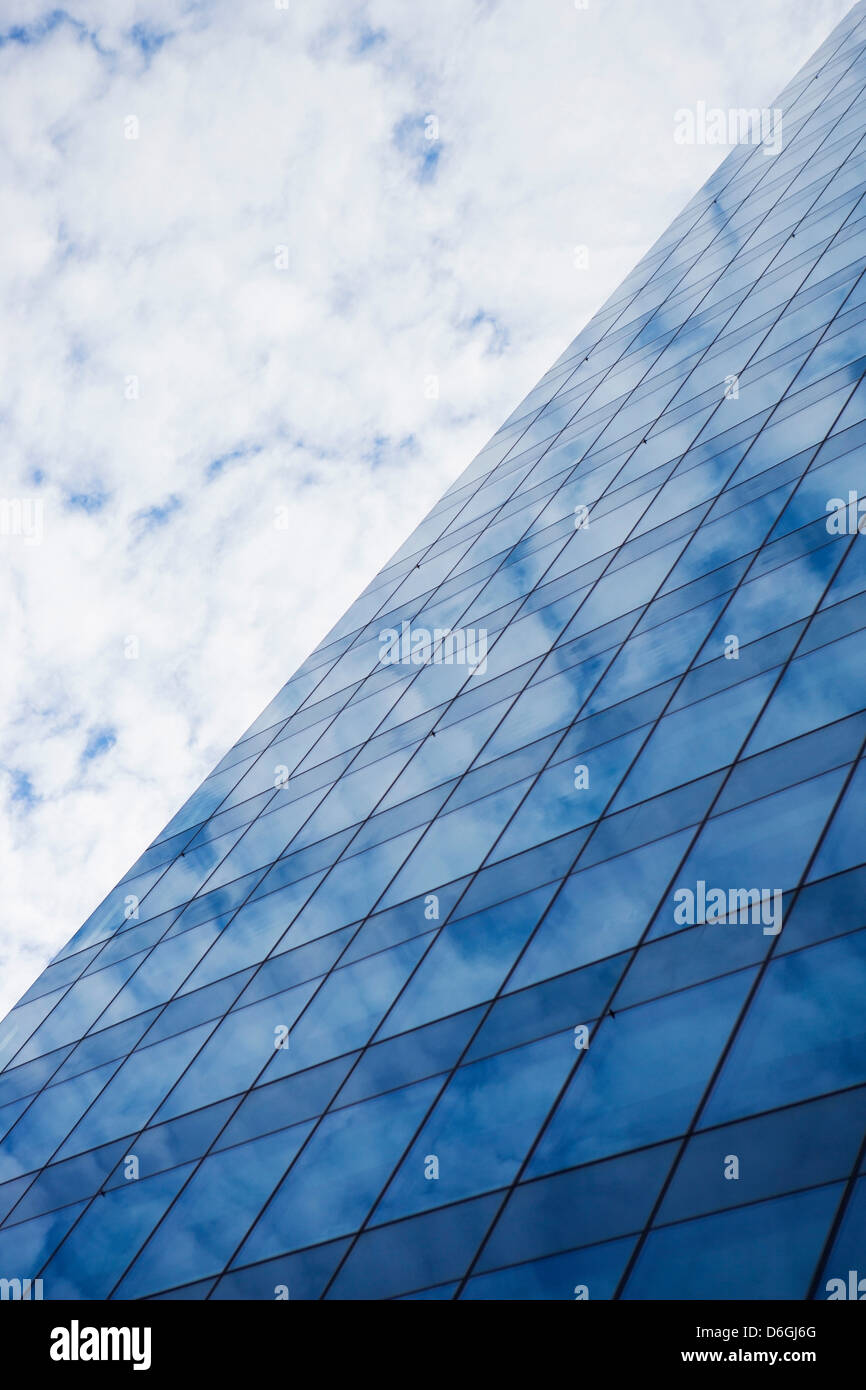Glass skyscraper and cloudy sky Stock Photo - Alamy